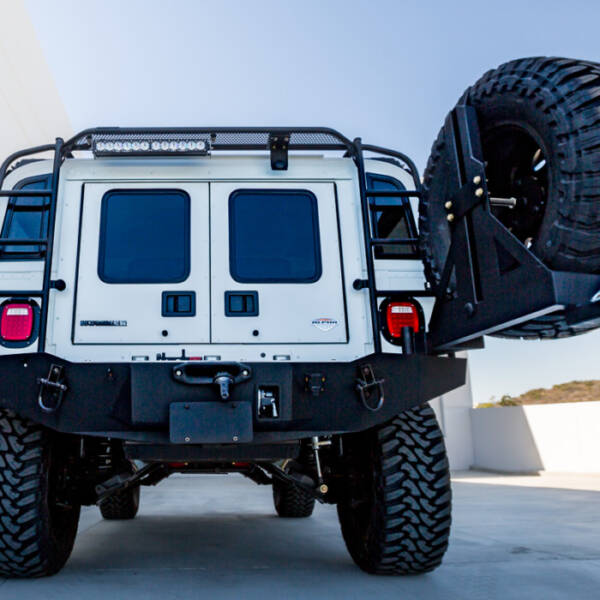 Predator Inc: HMMWV Drop Down Tire Carrier